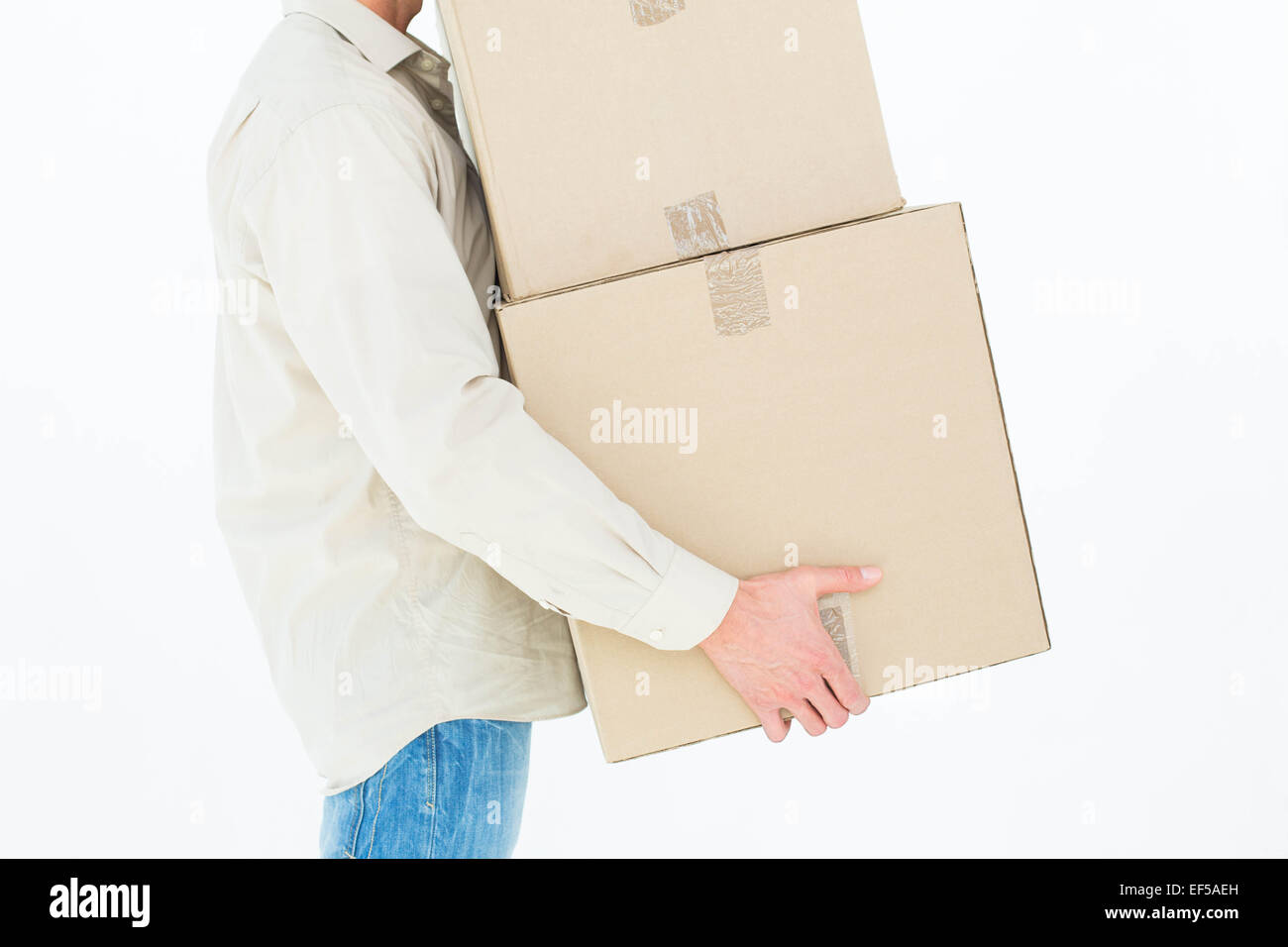 Delivery man carrying cardboard boxes Stock Photo - Alamy