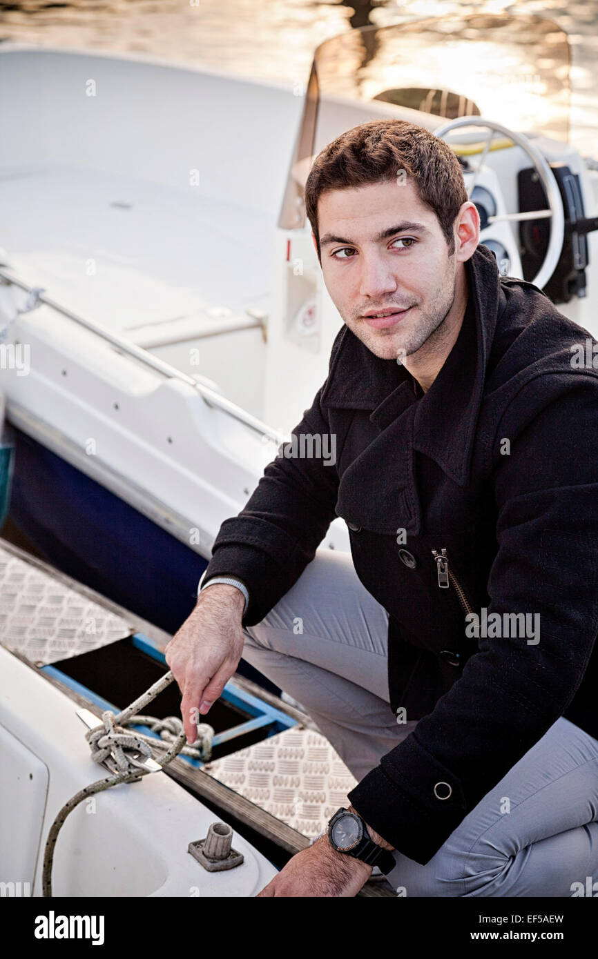 Man tying knot hi-res stock photography and images - Alamy