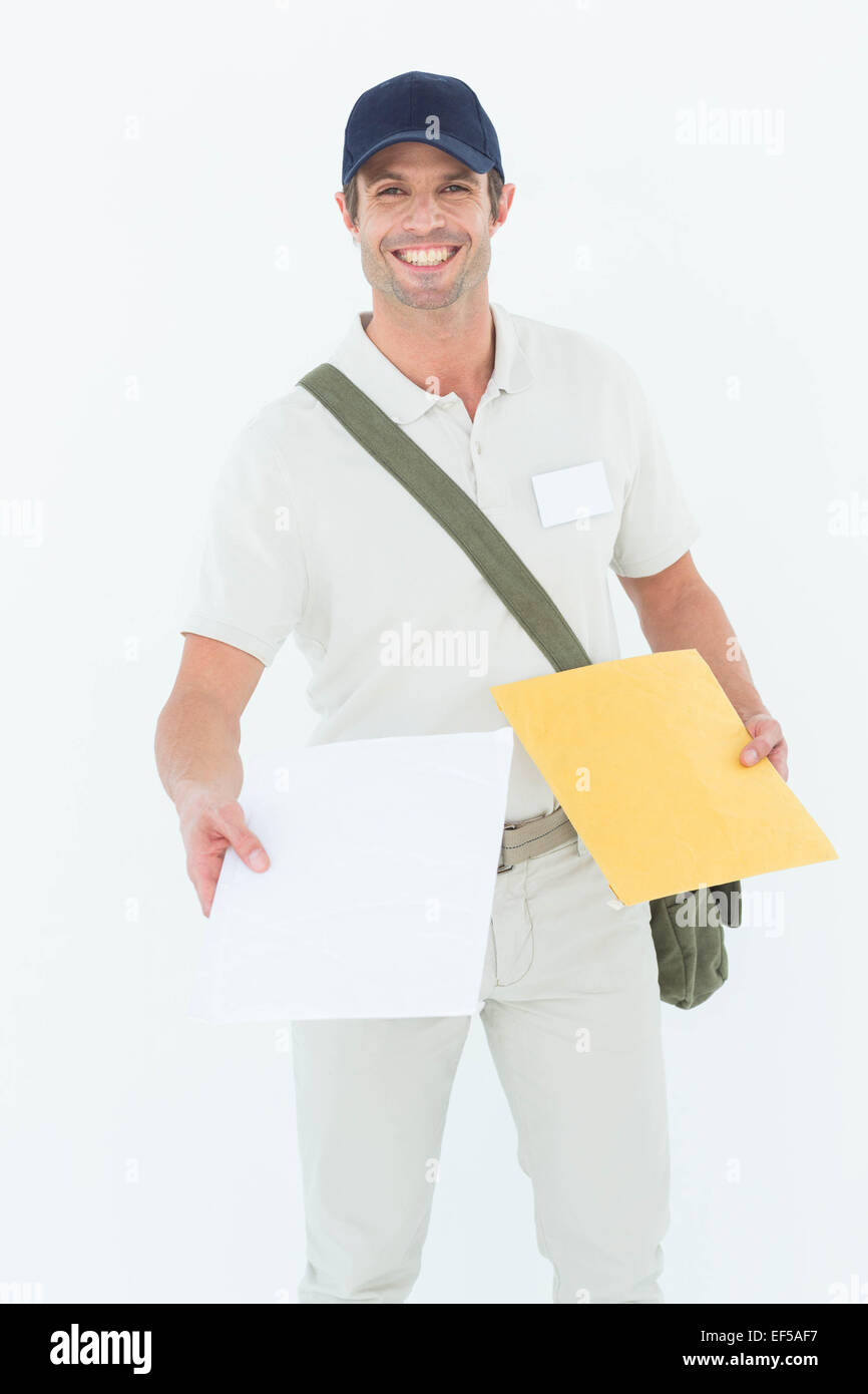 Happy courier man giving parcel Stock Photo - Alamy