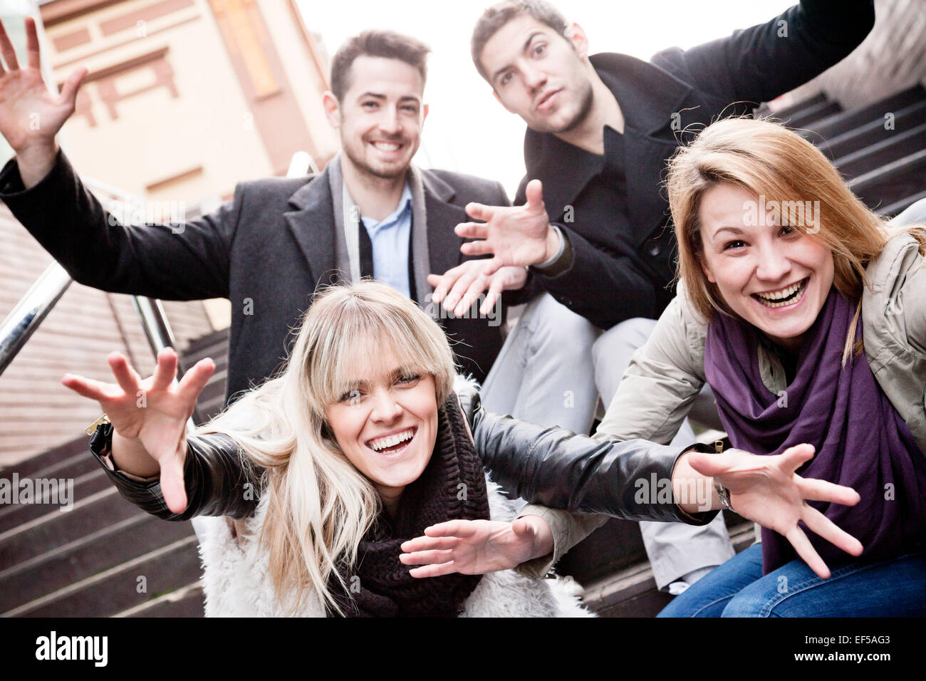 Group of friends having fun in town Stock Photo - Alamy
