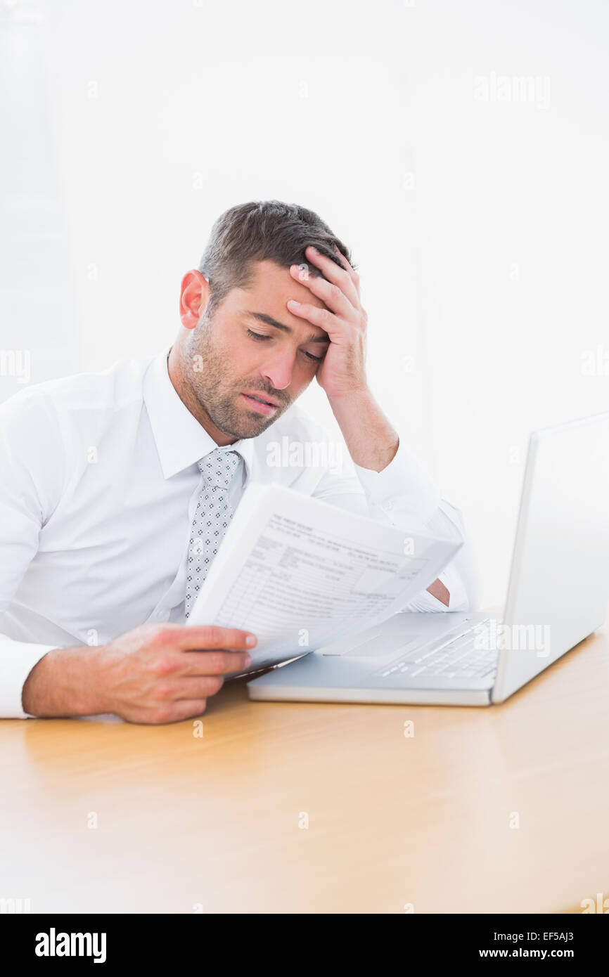 Confused businessman looking notebook hi-res stock photography and ...