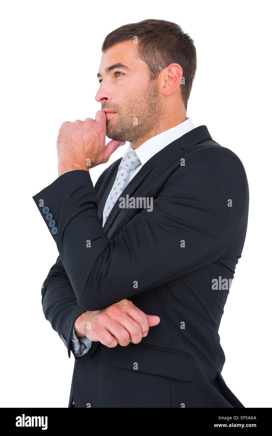 Frowning businessman thinking Stock Photo - Alamy