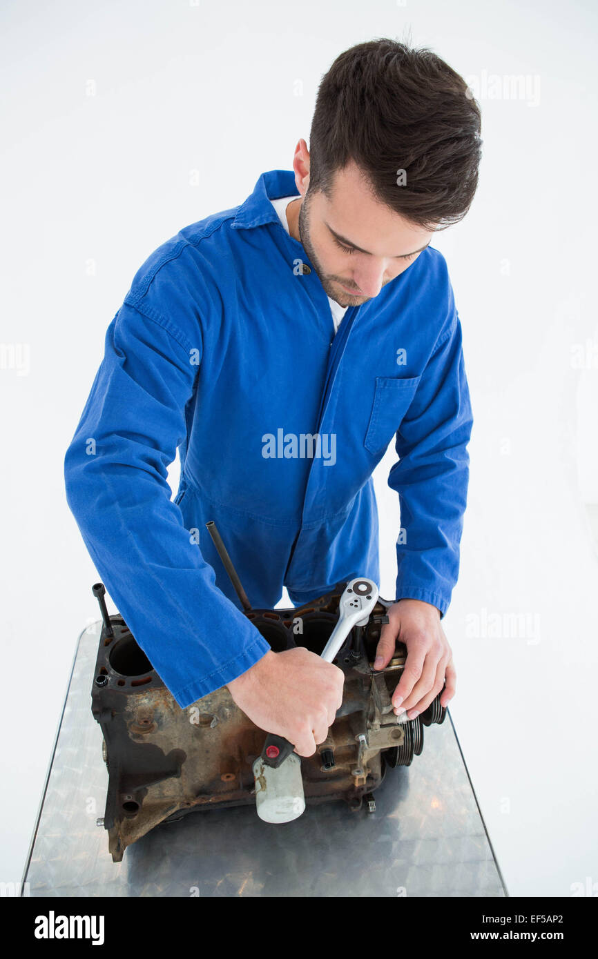 Young male mechanic repairing car engine Stock Photo - Alamy