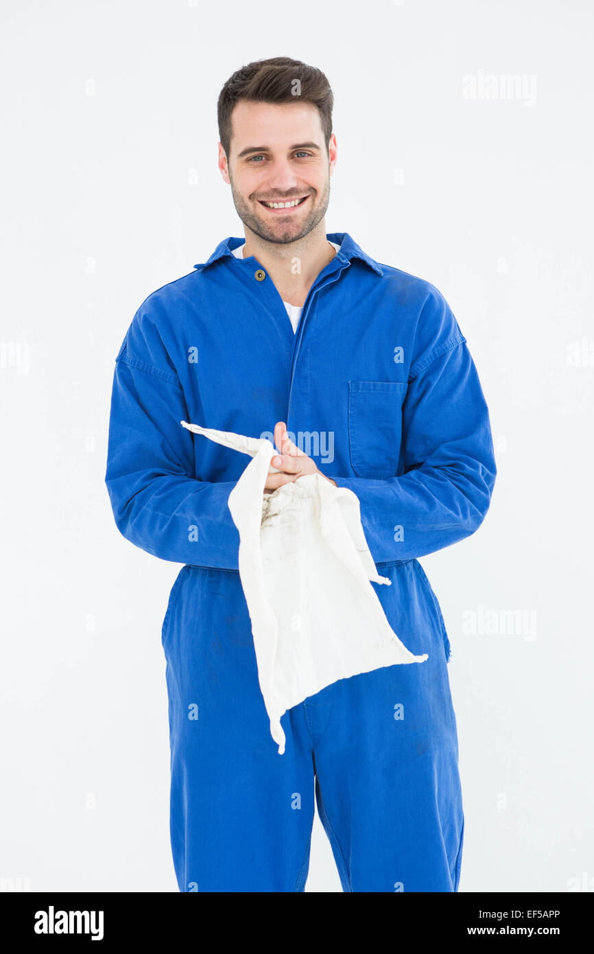 Male mechanic wiping hands with cloth Stock Photo - Alamy