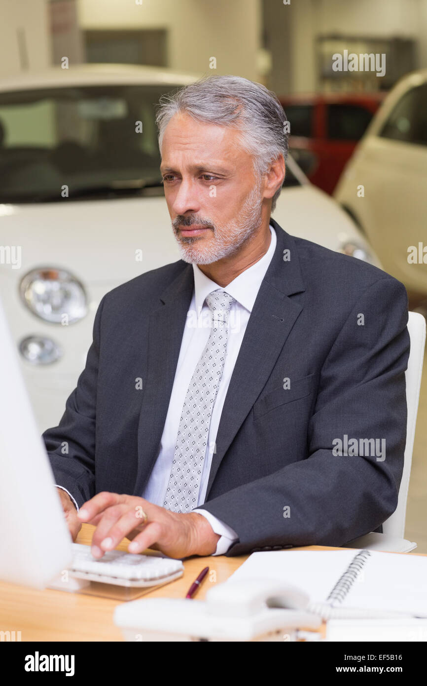 Focused businessman working on computer Stock Photo - Alamy