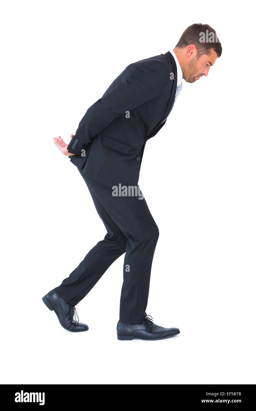Businessman putting hands behind Stock Photo - Alamy