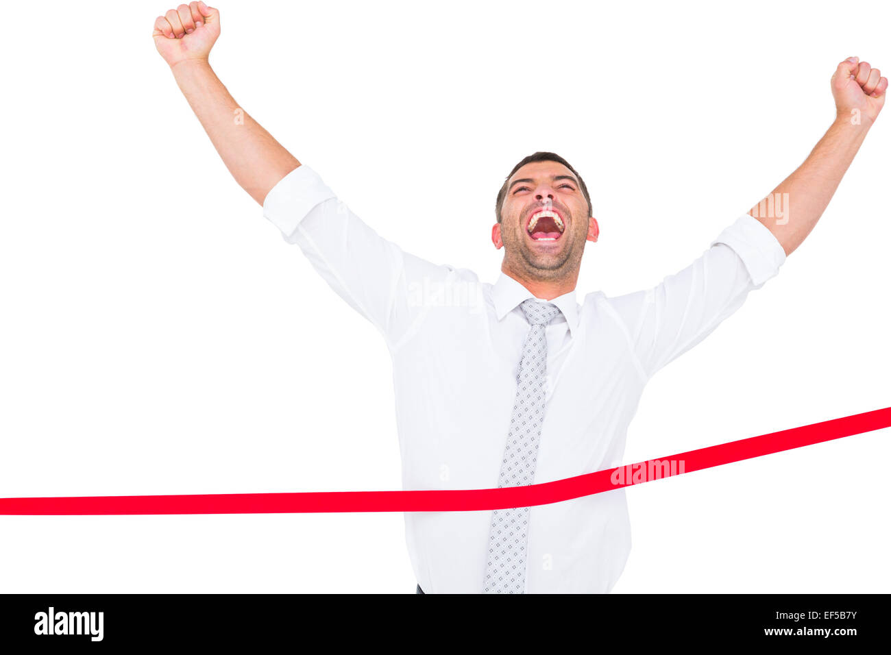 Businessman crossing the finish line Stock Photo - Alamy