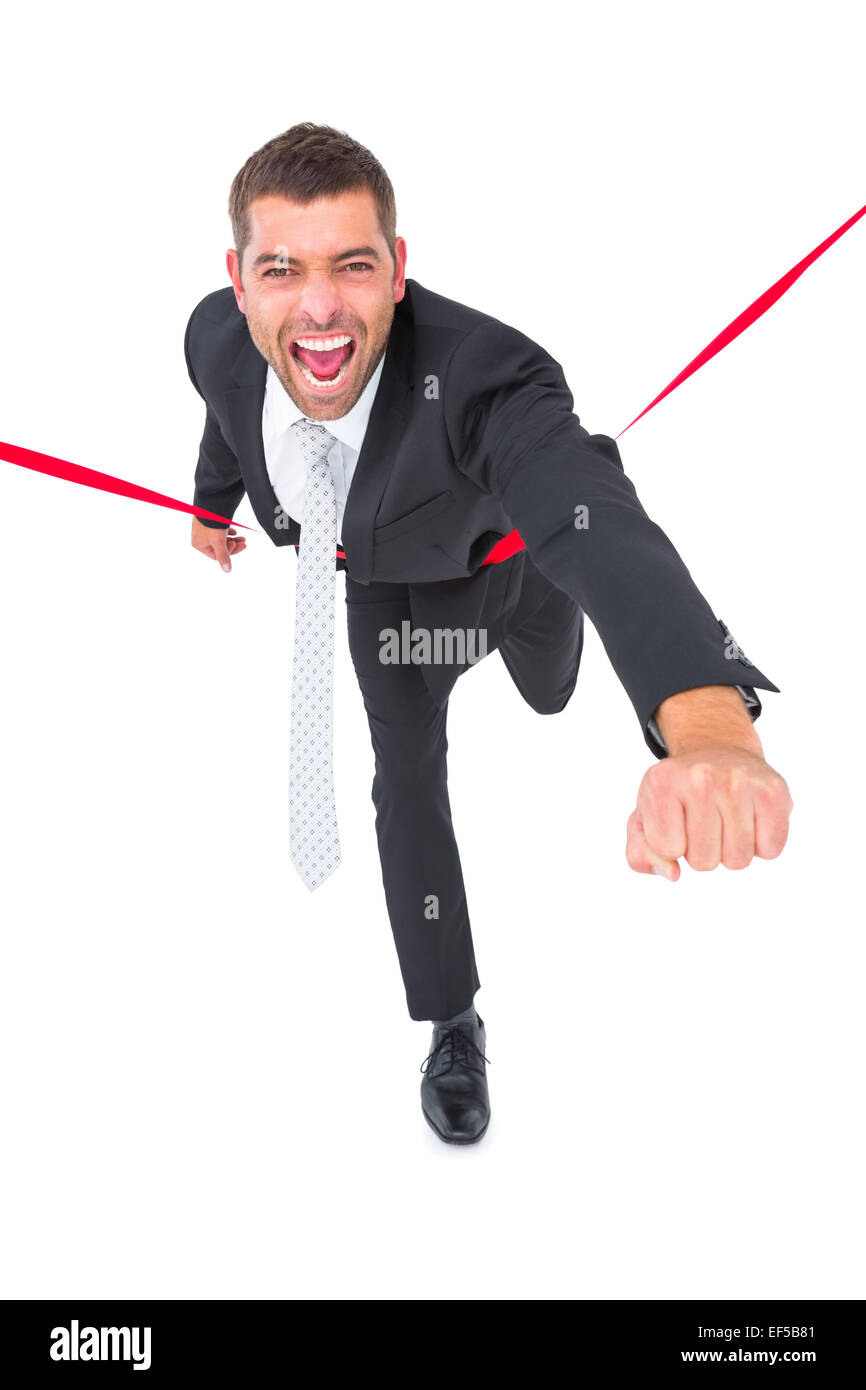 Businessman crossing the finish line Stock Photo - Alamy