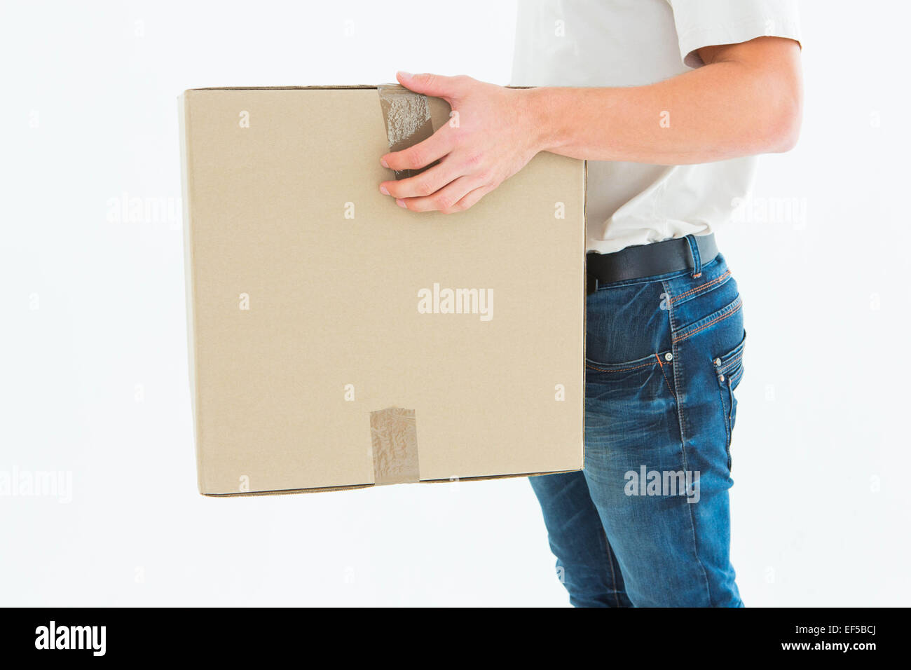 Delivery man carrying cardboard box Stock Photo - Alamy