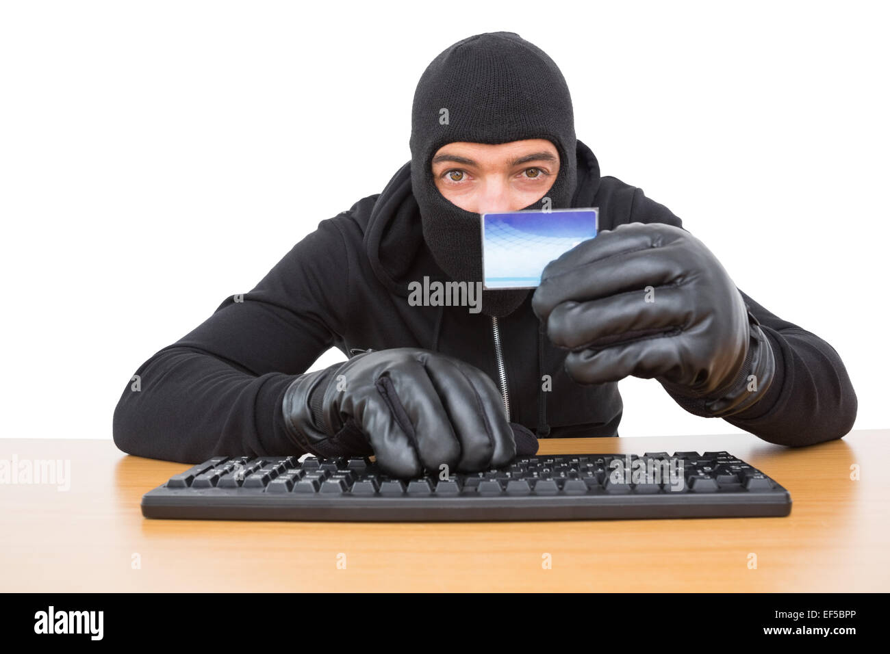 Hacker using card to steal identity Stock Photo - Alamy