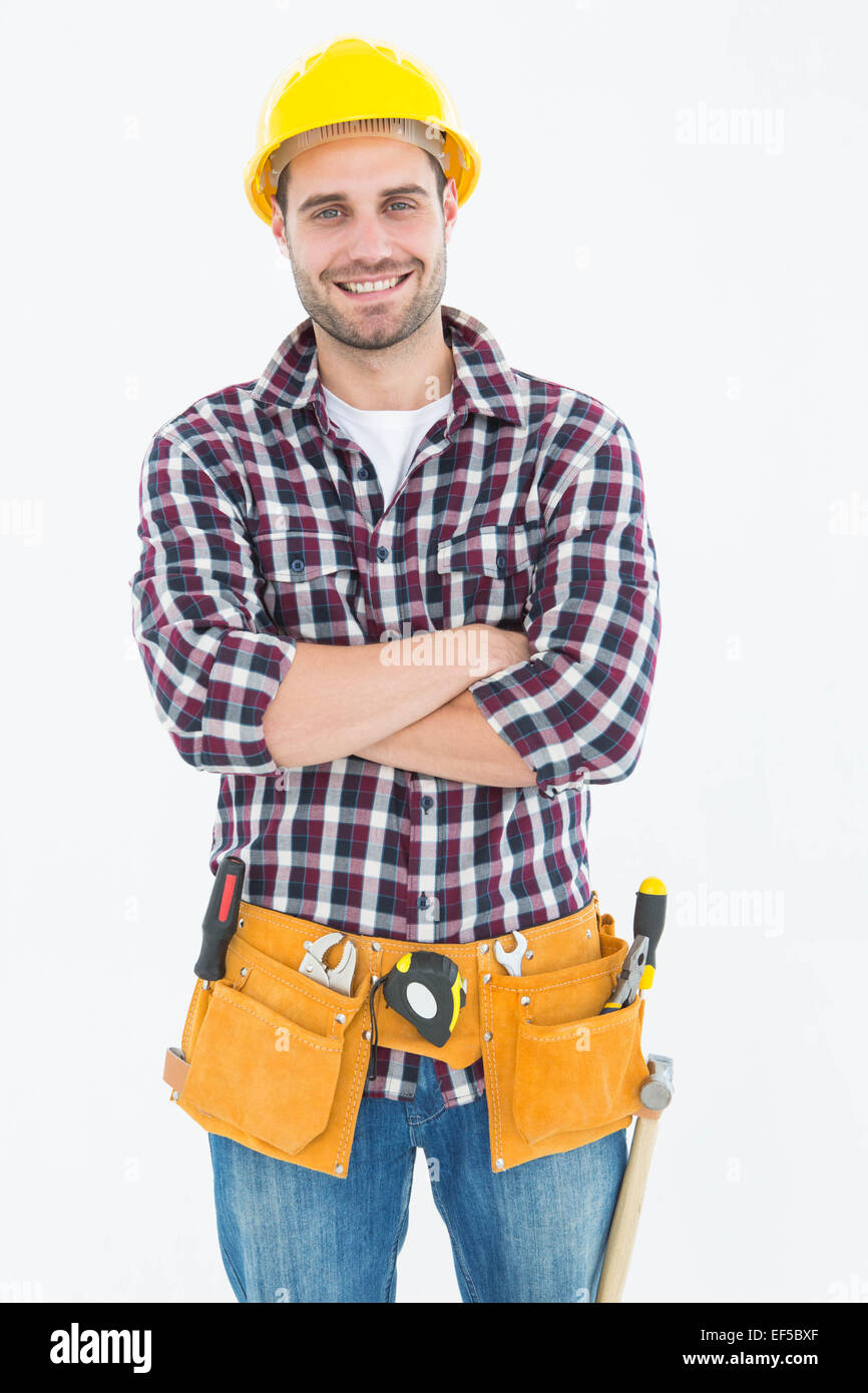 Confident male handyman wearing tool belt Stock Photo - Alamy