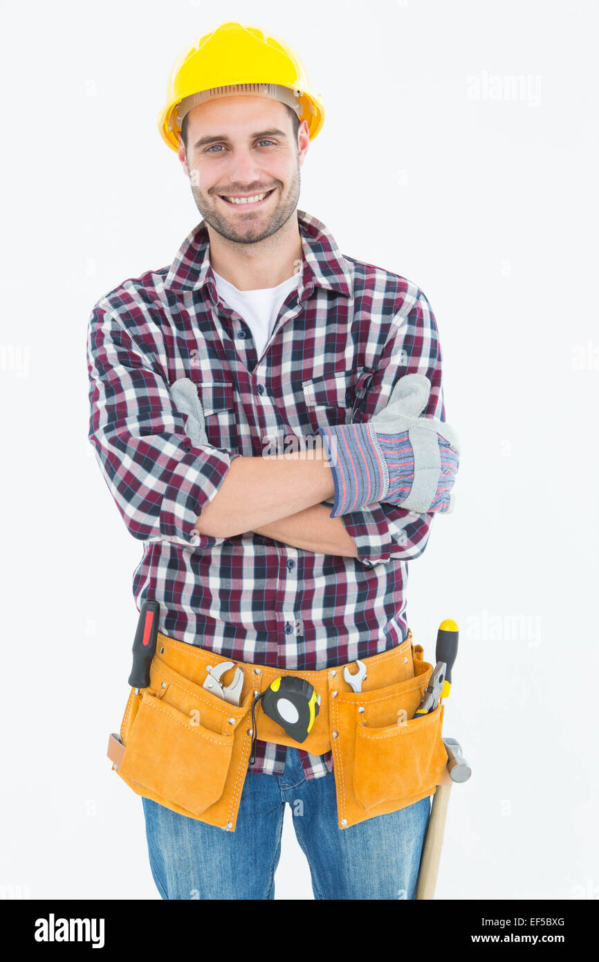 Happy male repairman wearing tool belt Stock Photo - Alamy