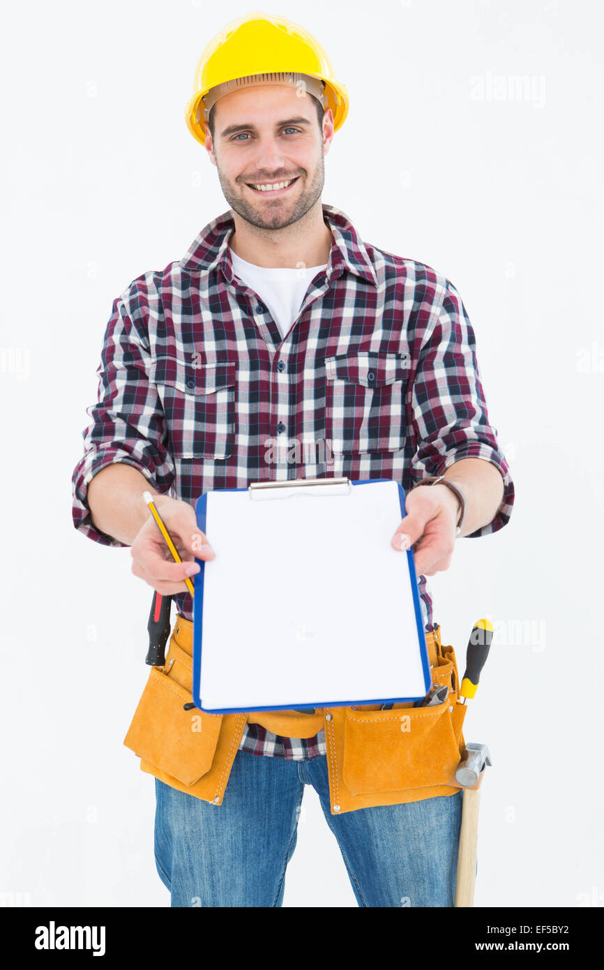 Happy male repairman showing clipboard Stock Photo - Alamy