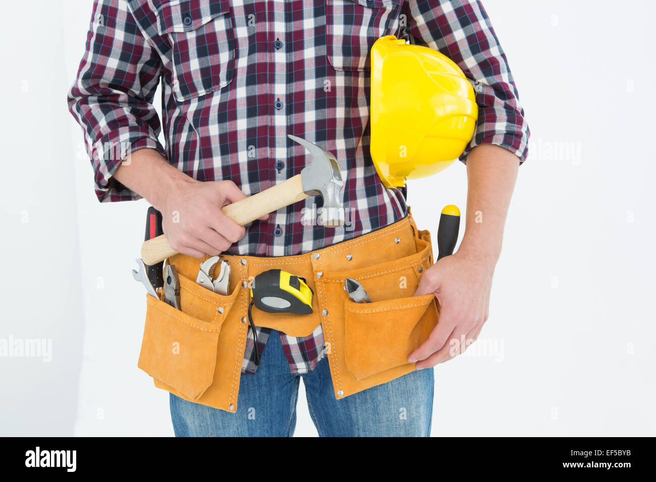 Repairman with hard hat and hammer Stock Photo - Alamy
