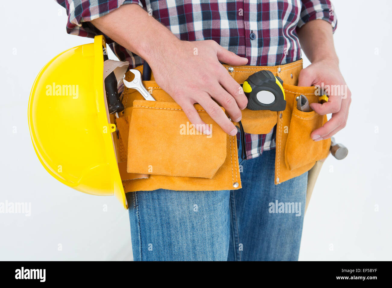 Handyman with tool belt and handyman Stock Photo - Alamy