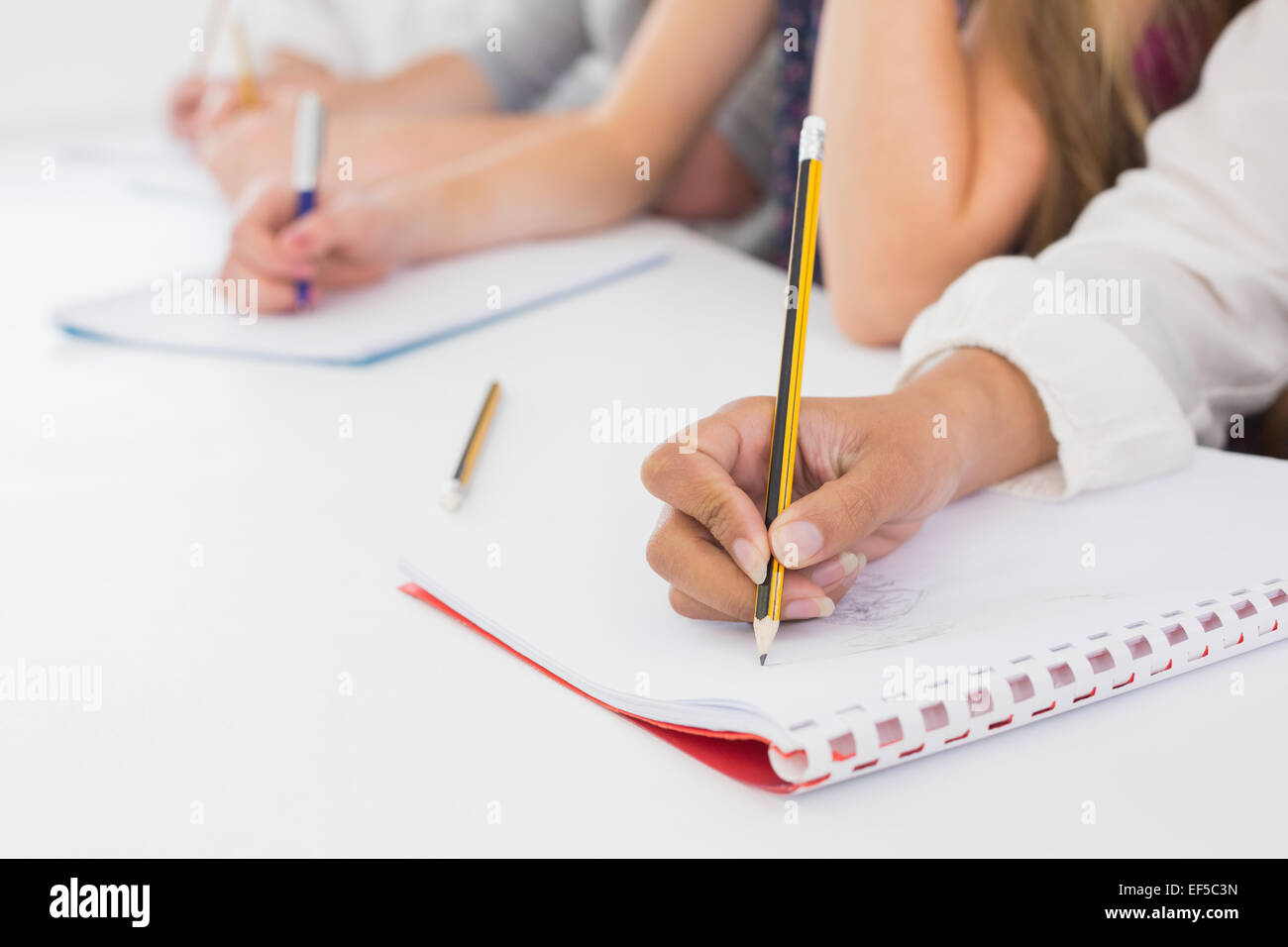 Students taking notes in class Stock Photo - Alamy
