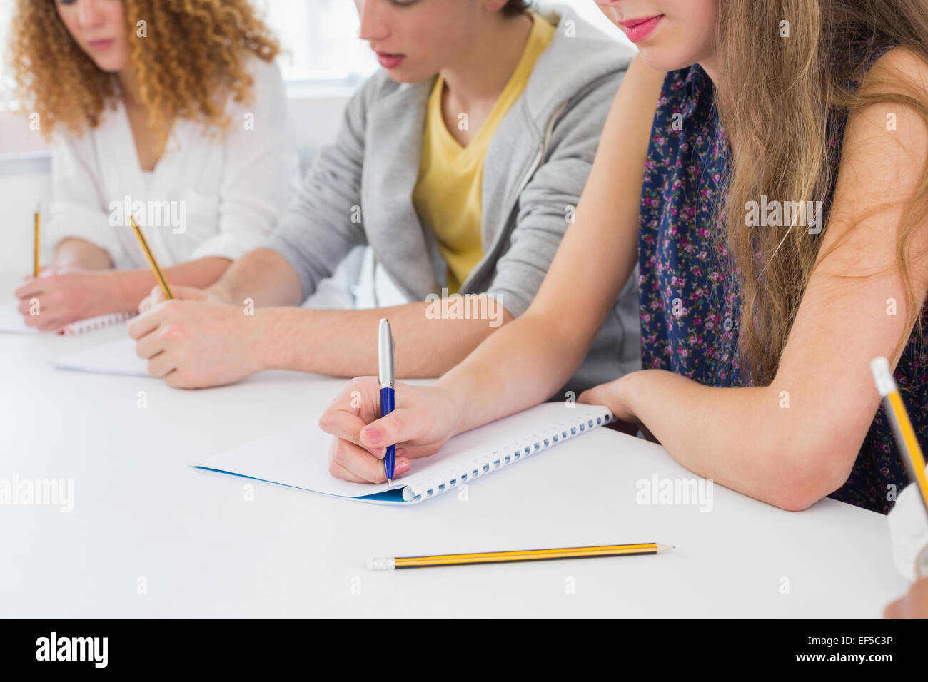 Students taking notes in class Stock Photo - Alamy