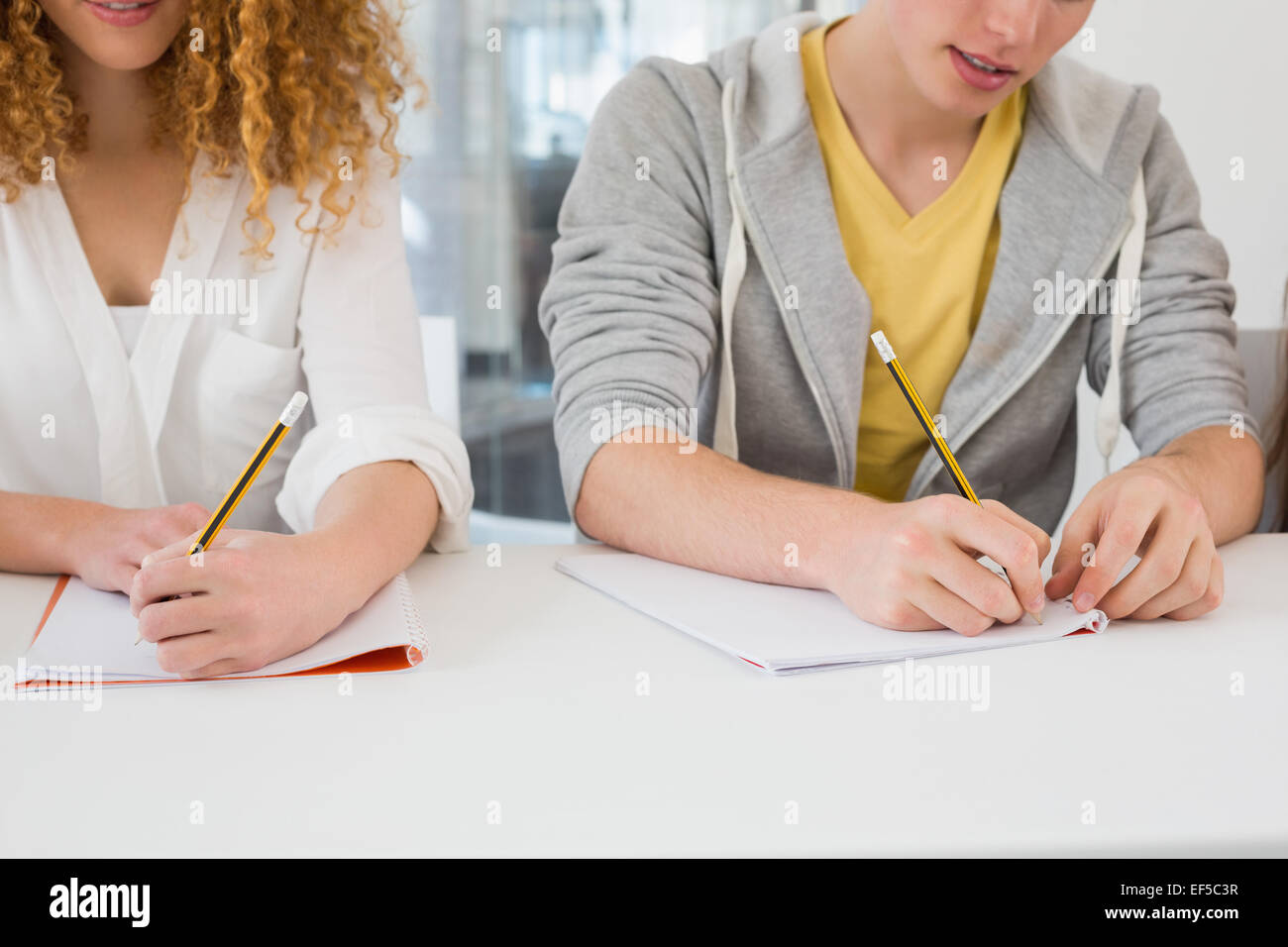 Students taking notes in class Stock Photo - Alamy