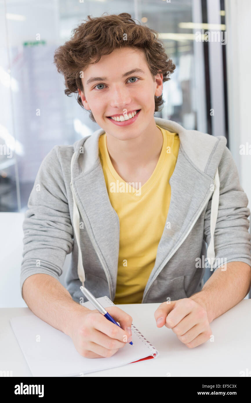 Student taking notes in class Stock Photo - Alamy