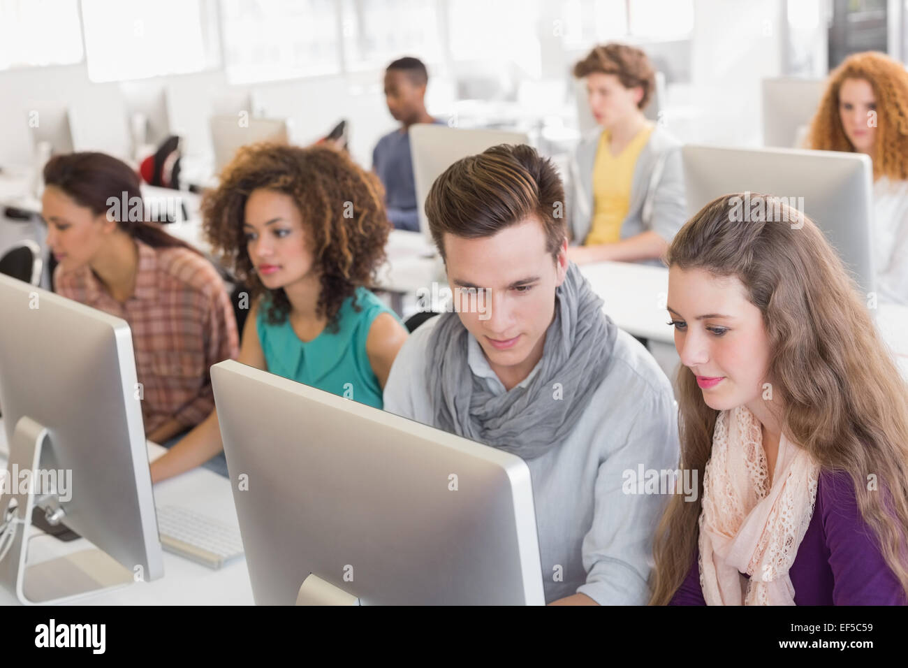 Students working in computer room Stock Photo - Alamy