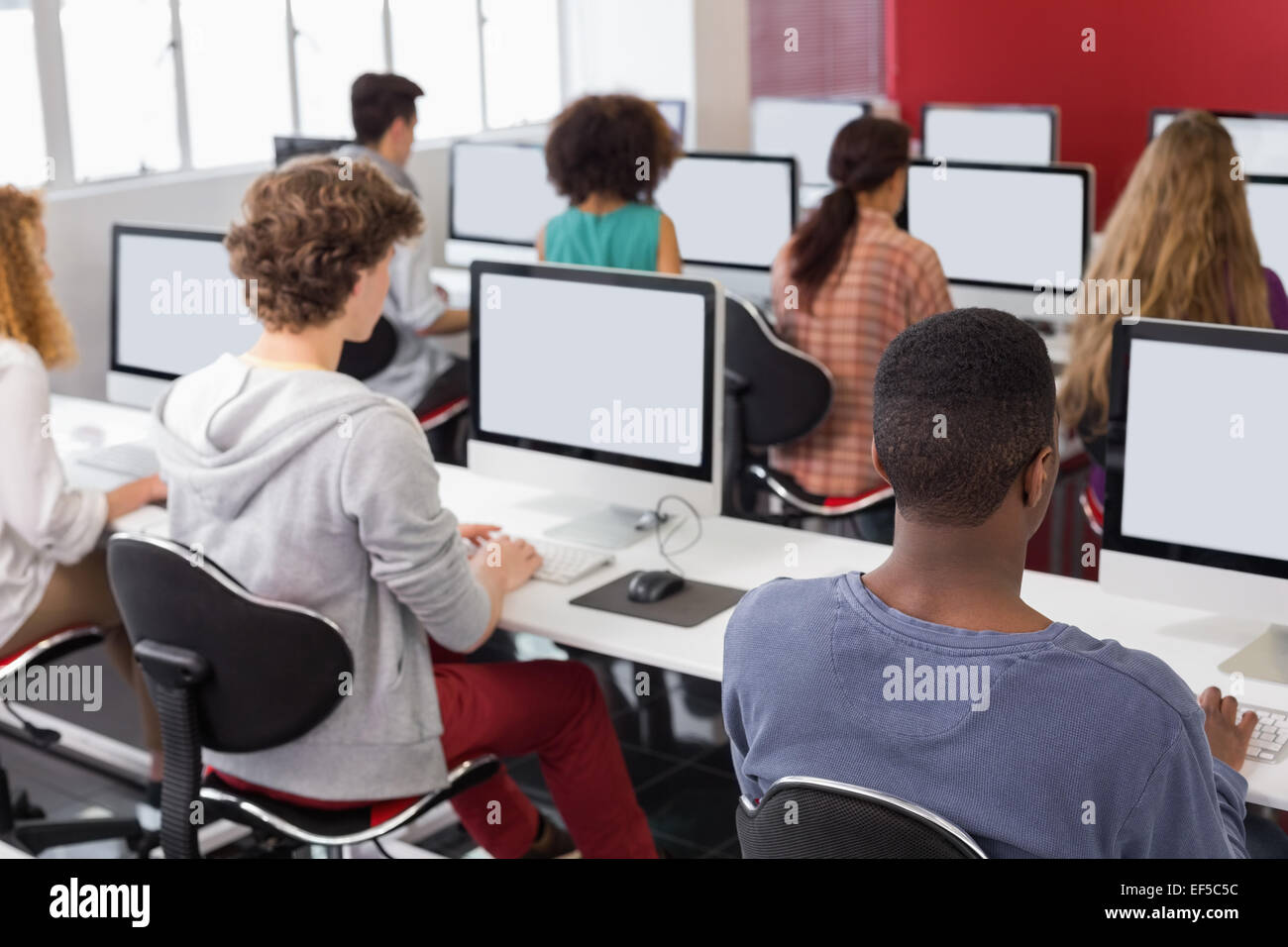 Students working in computer room Stock Photo - Alamy