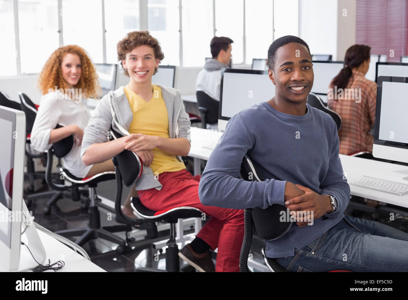 Students working in computer room Stock Photo - Alamy