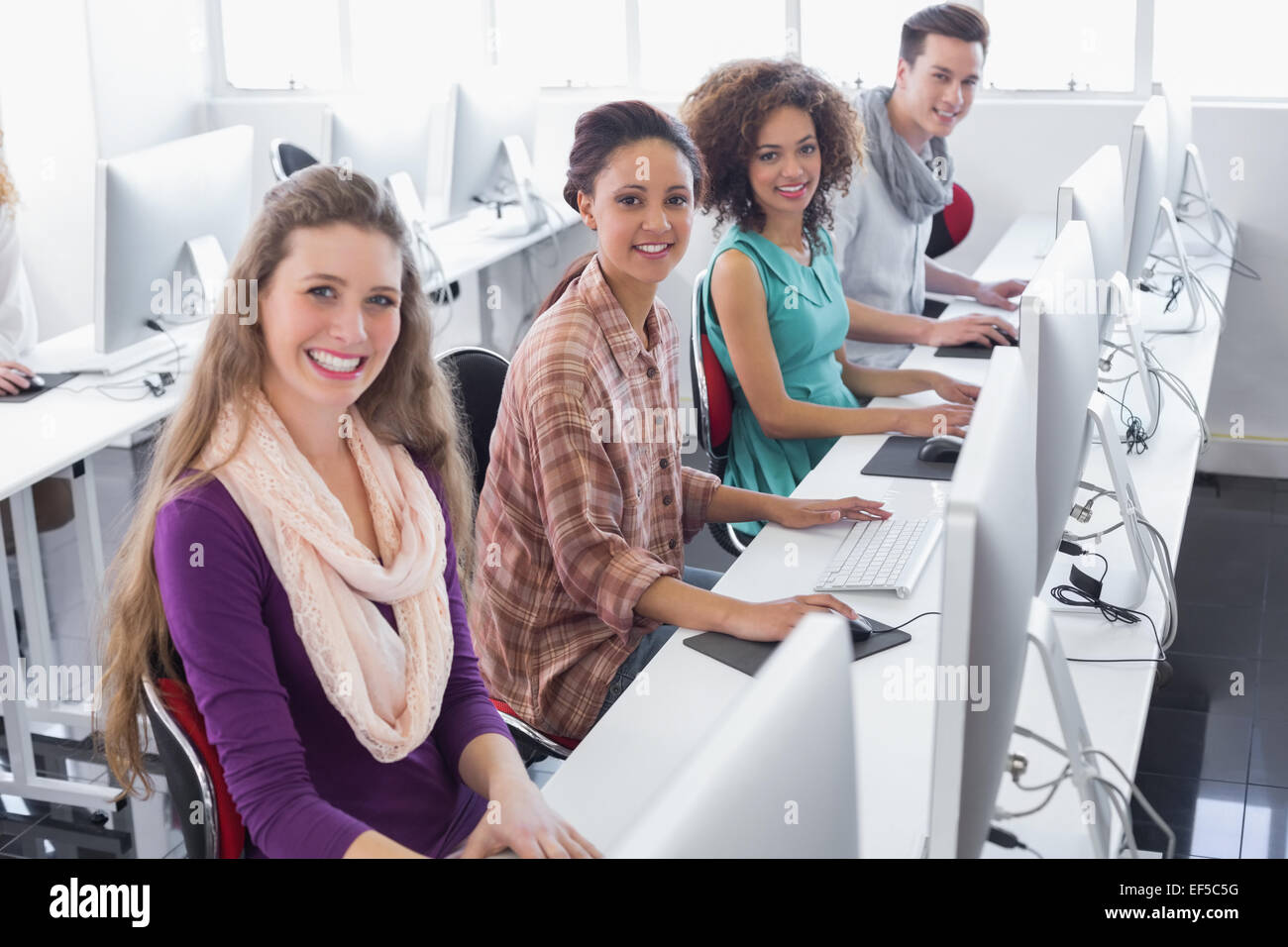 Students working in computer room Stock Photo - Alamy