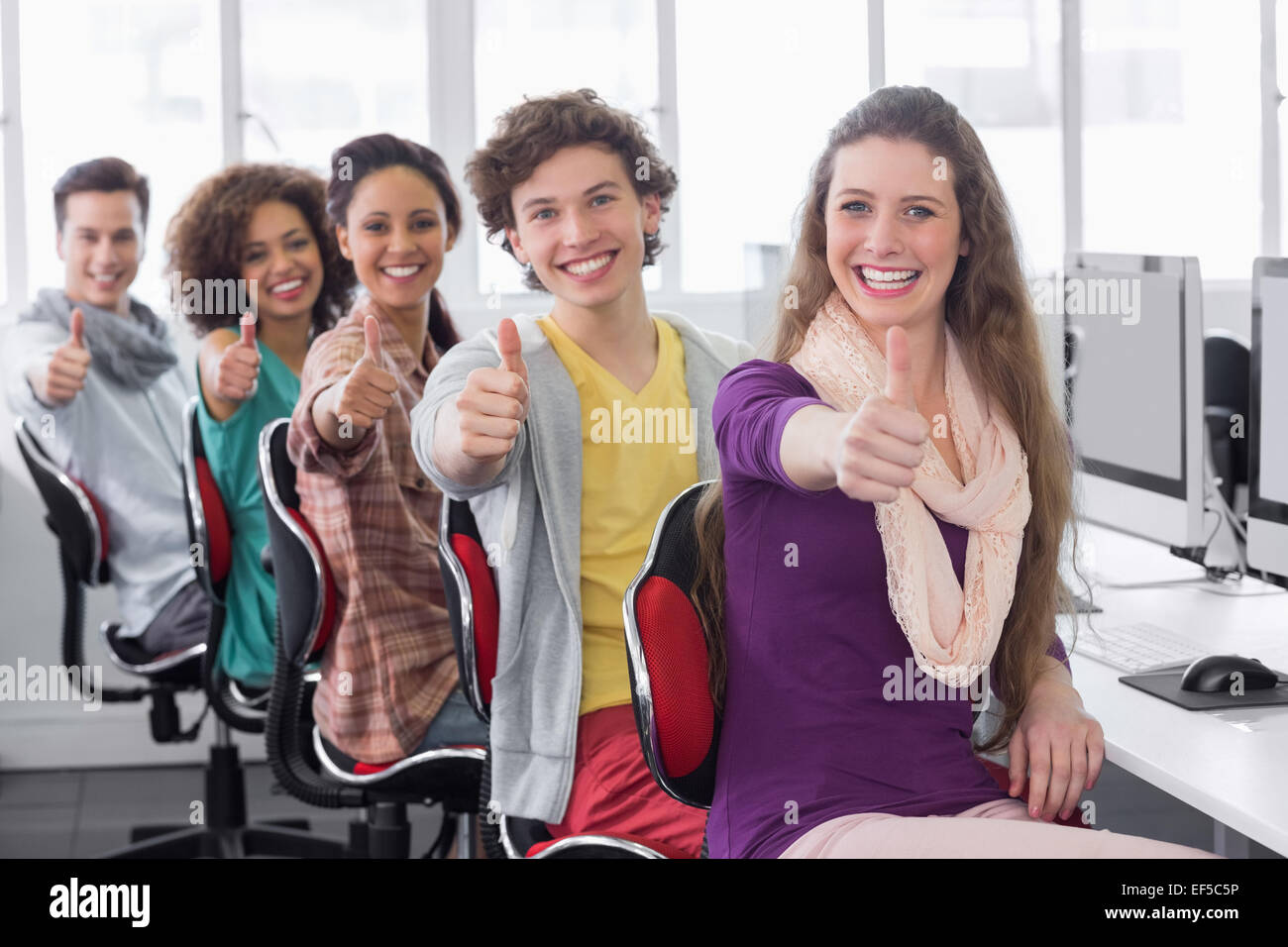 Students smiling at camera in computer class Stock Photo - Alamy