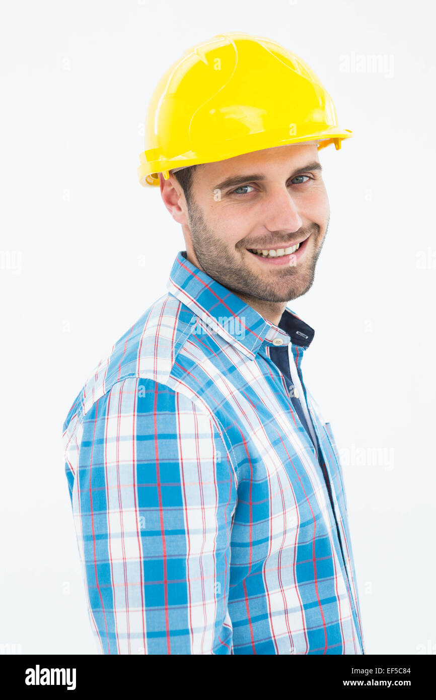 Confident repairman wearing hard hat Stock Photo - Alamy