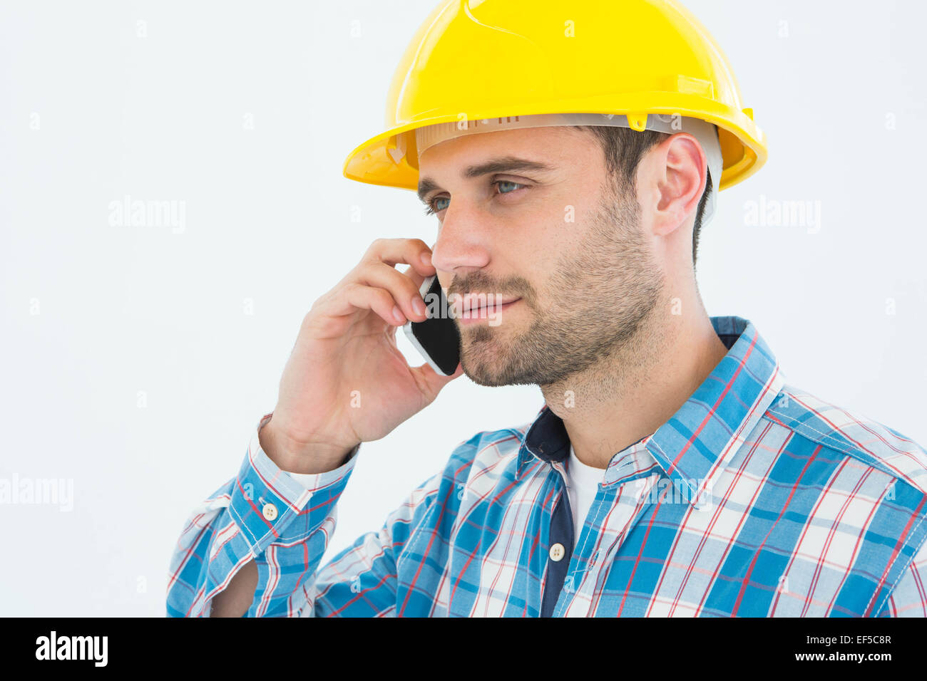 Construction worker using mobile phone Stock Photo - Alamy