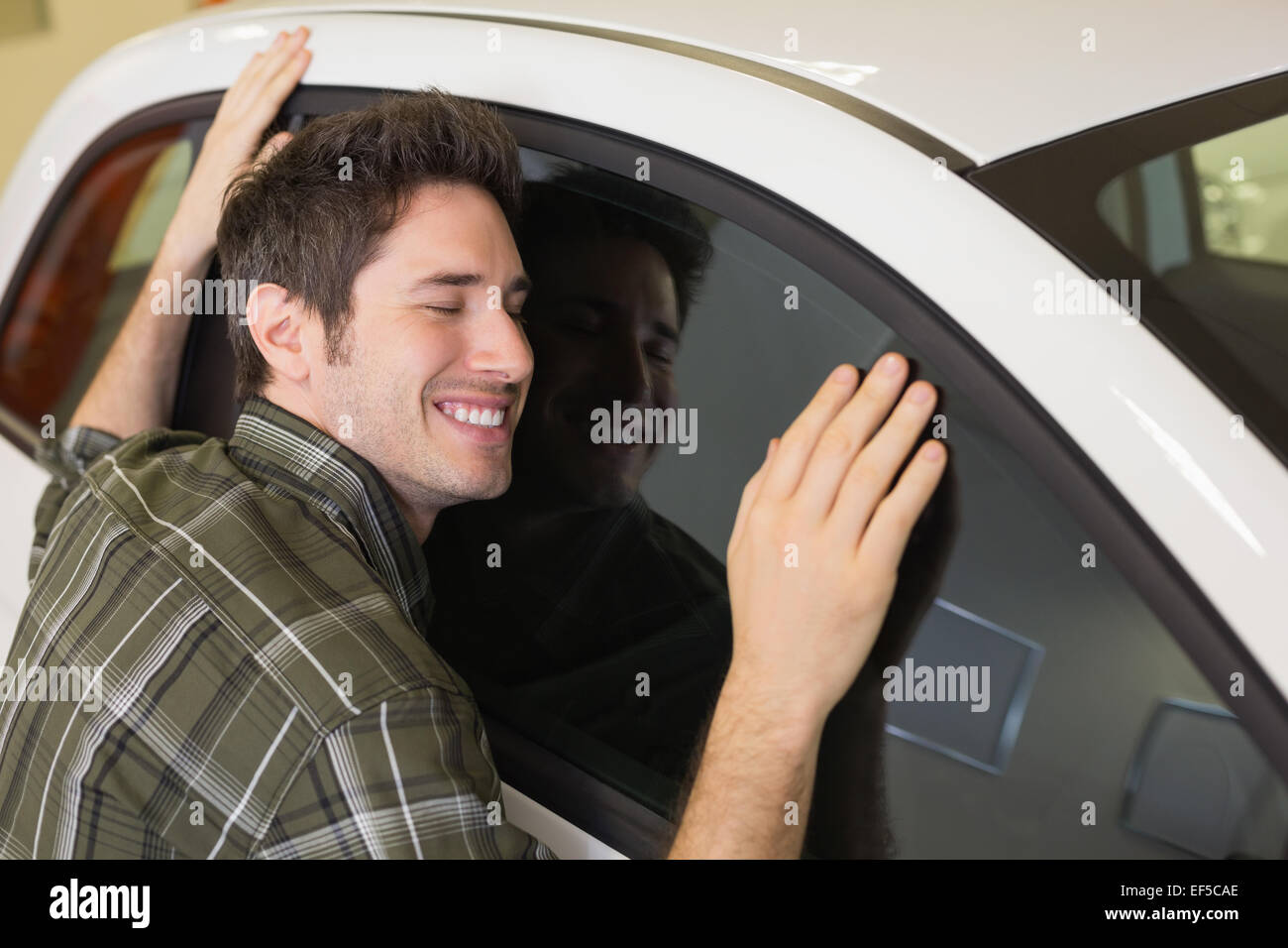 Man hugging on a car Stock Photo - Alamy