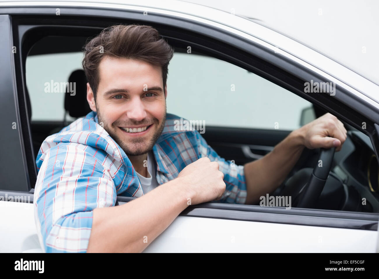 Young man smiling at camera Stock Photo - Alamy