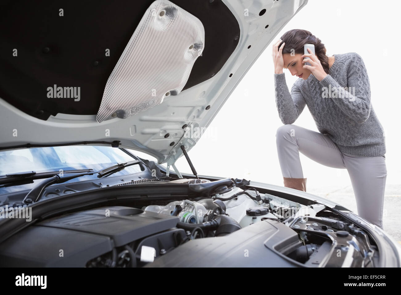 Stressed woman driver standing hi-res stock photography and images - Alamy