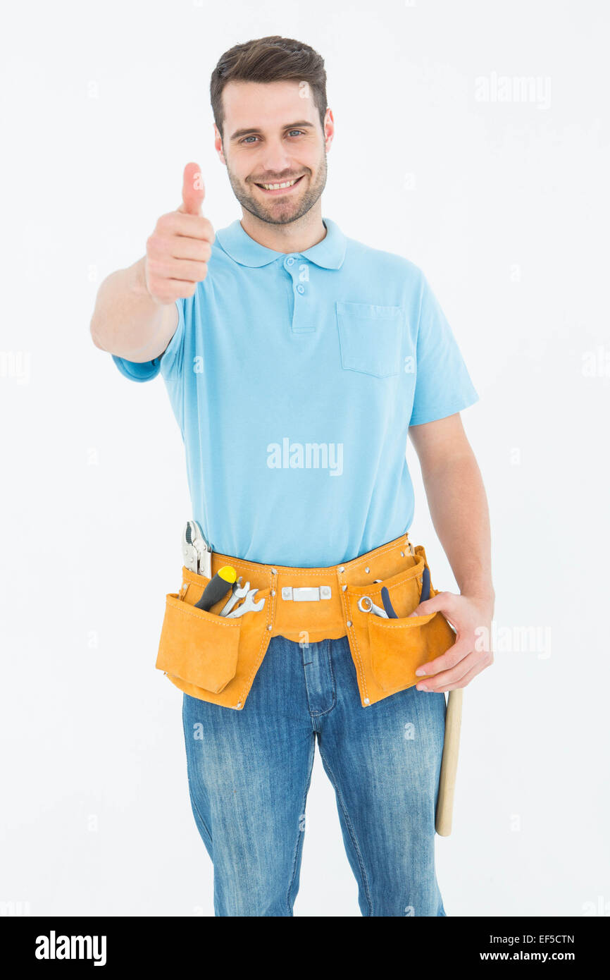Happy carpenter gesturing thumbs up Stock Photo - Alamy