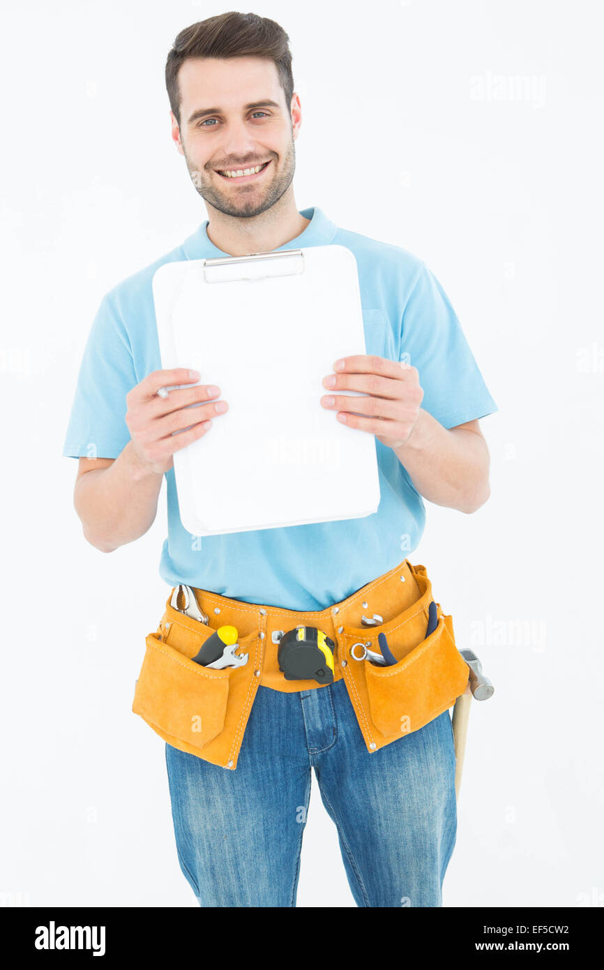 Construction worker showing blank paper on clipboard Stock Photo - Alamy