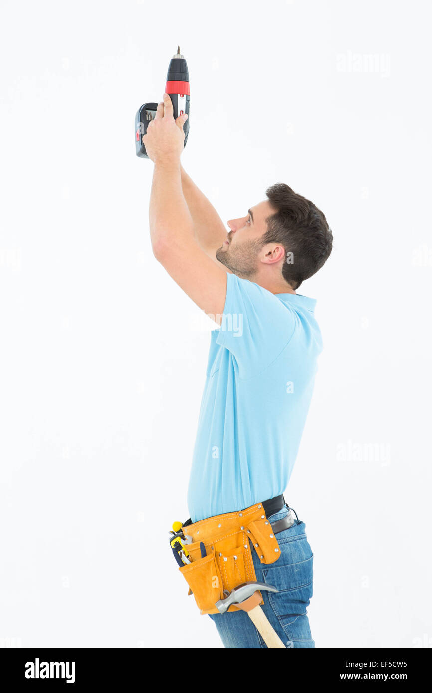 Repairman using hand drill Stock Photo - Alamy