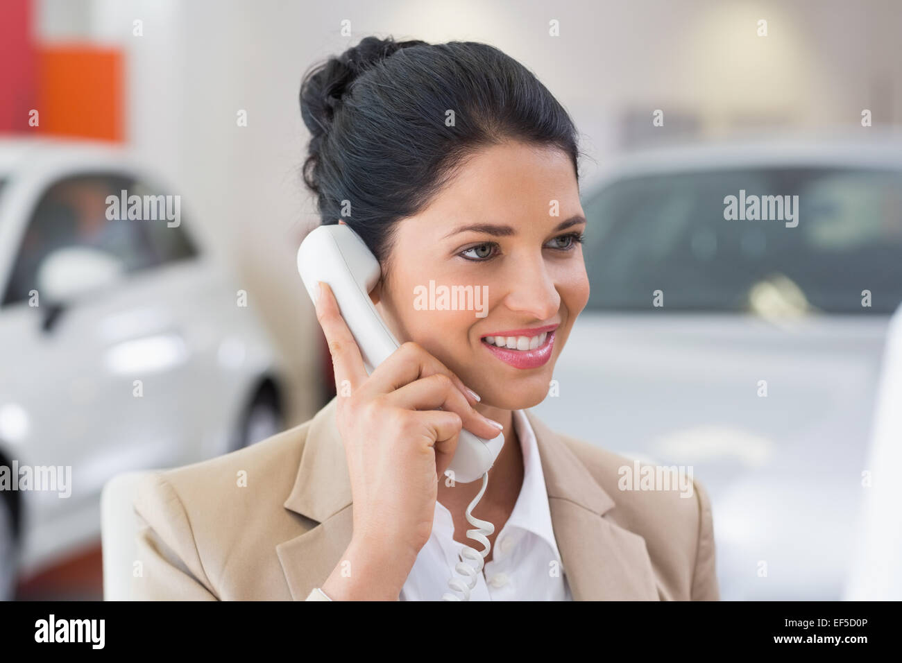 Smiling businessman making a phone call Stock Photo - Alamy