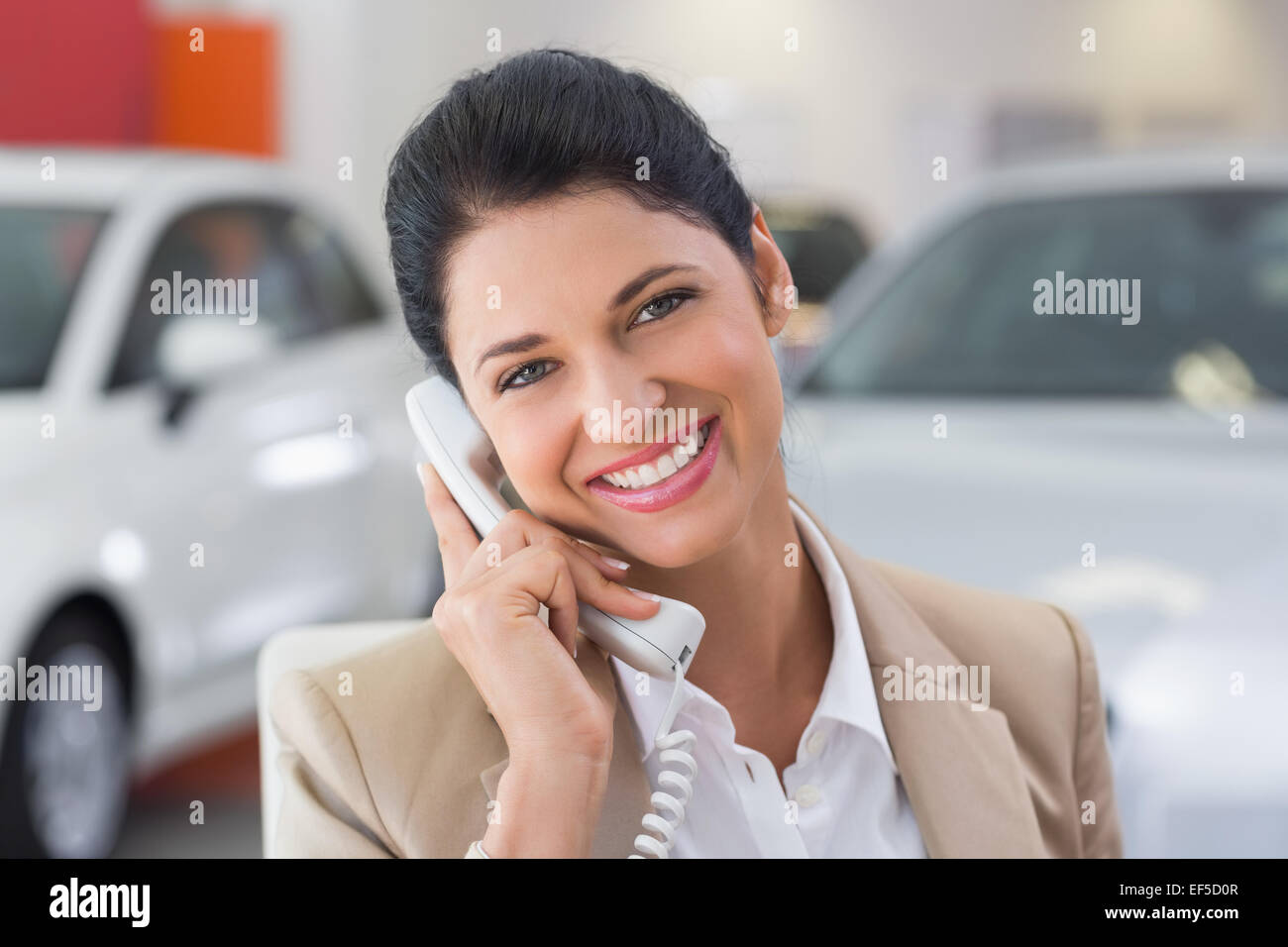 Smiling businessman making a phone call Stock Photo - Alamy