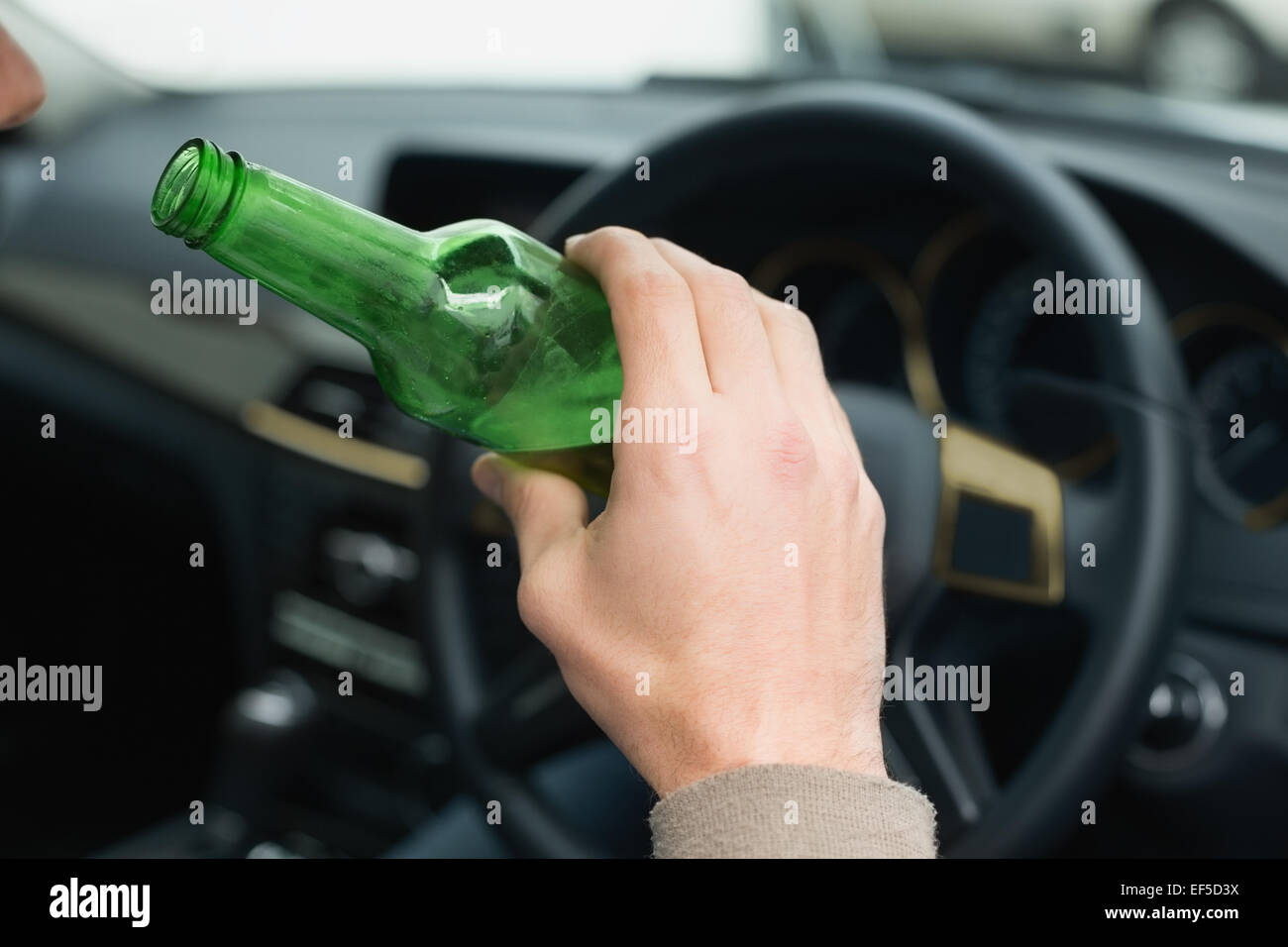 Man drinking beer while driving Stock Photo - Alamy
