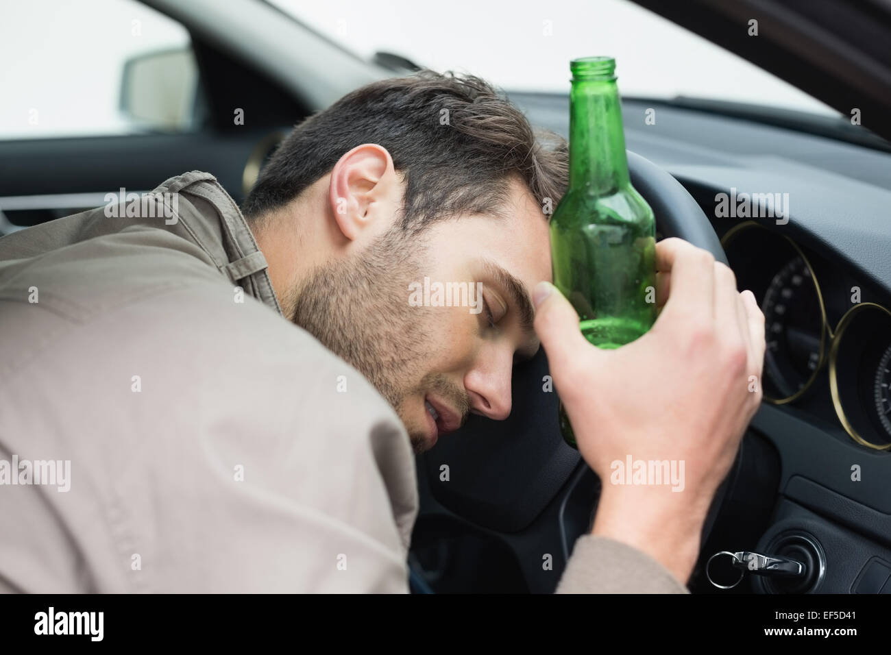 Man drinking beer while driving Stock Photo - Alamy
