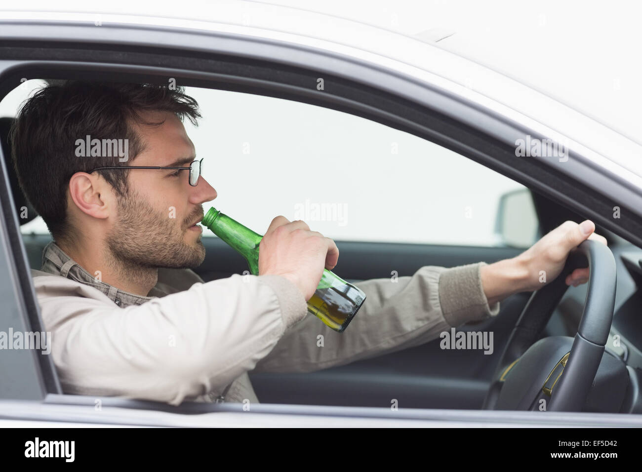 Man drinking beer while driving Stock Photo - Alamy