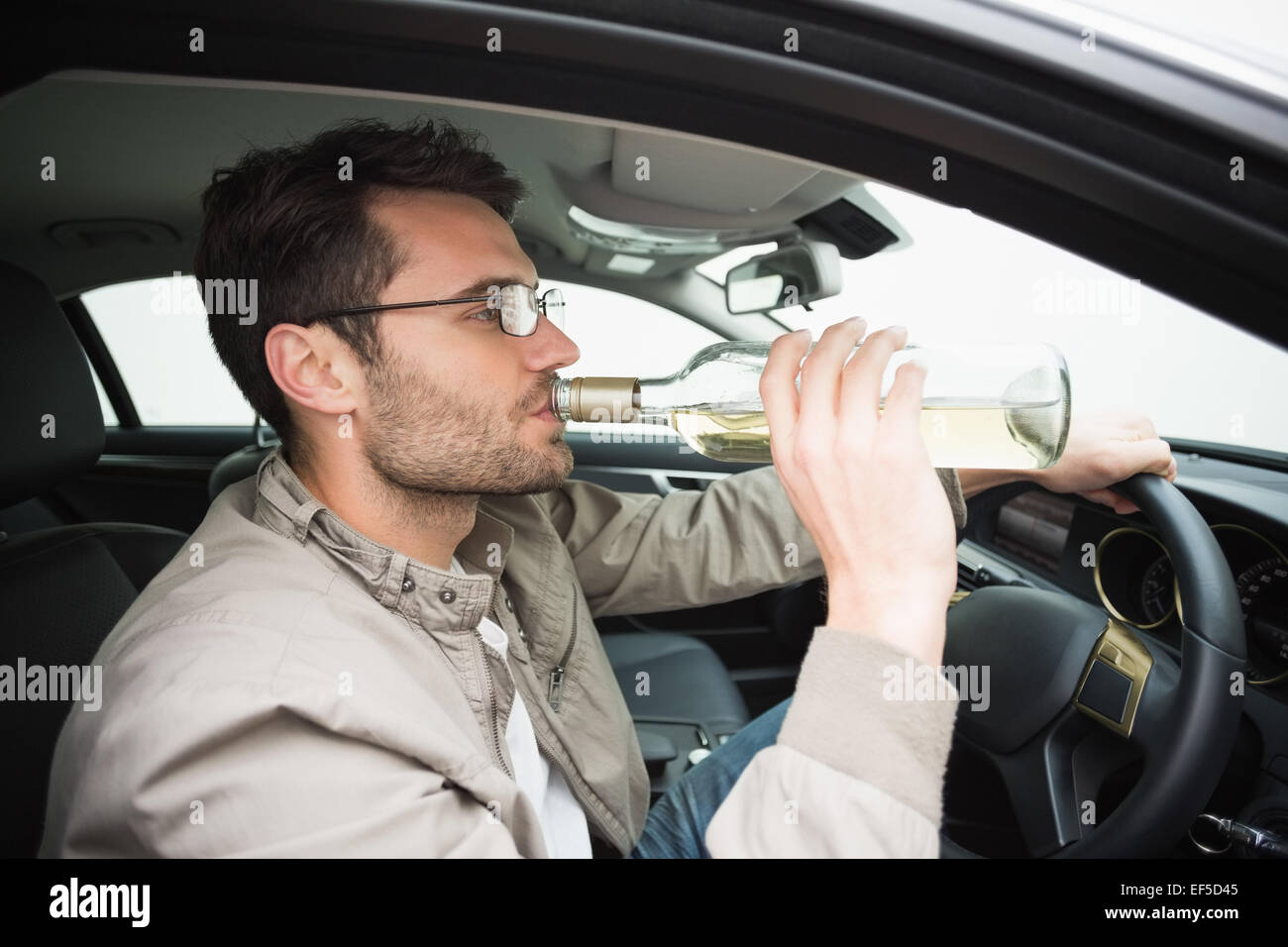 Man drinking beer while driving Stock Photo - Alamy