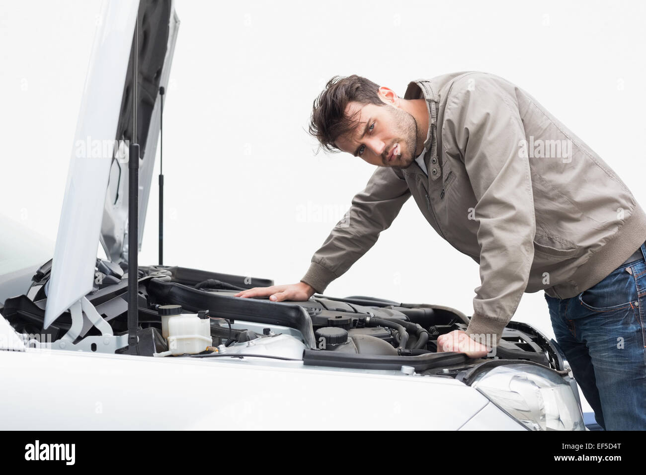 Stressed man looking at engine Stock Photo - Alamy