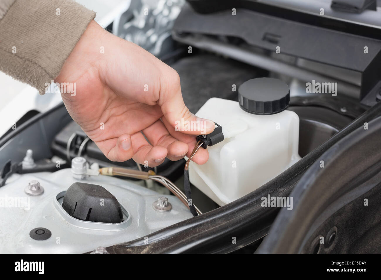 Man checking the engine of his car Stock Photo - Alamy