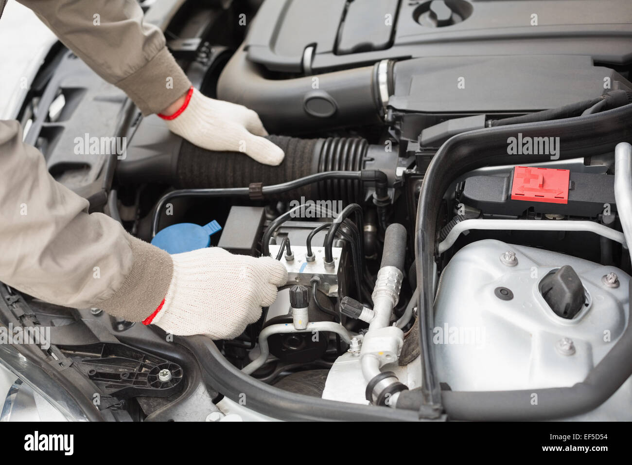 Man checking the engine of his car Stock Photo - Alamy