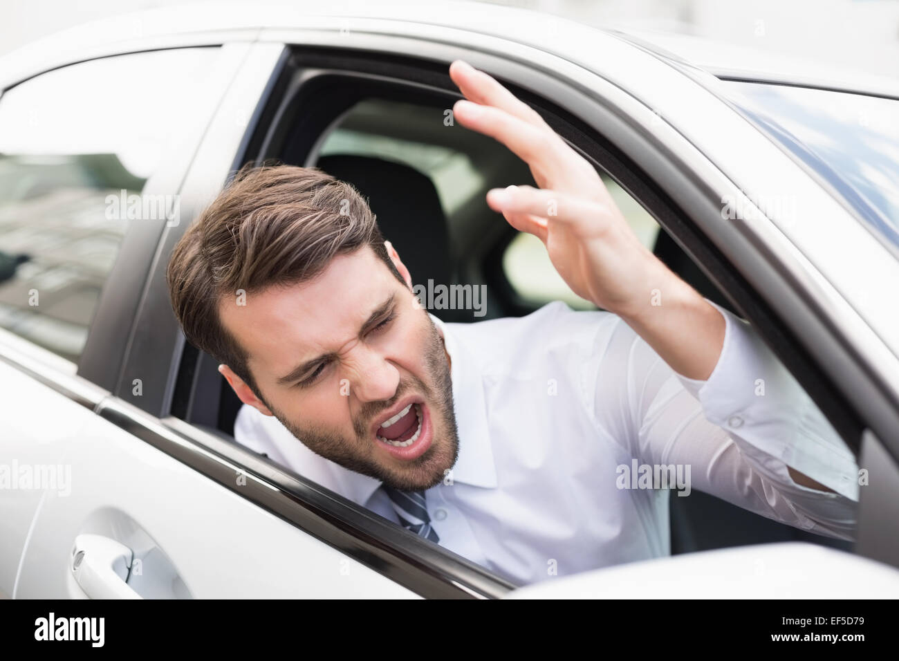 Businessman experiencing road rage Stock Photo - Alamy