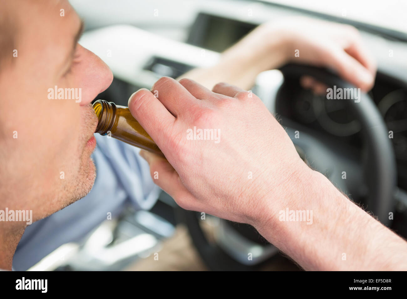 Man drinking beer while driving Stock Photo - Alamy