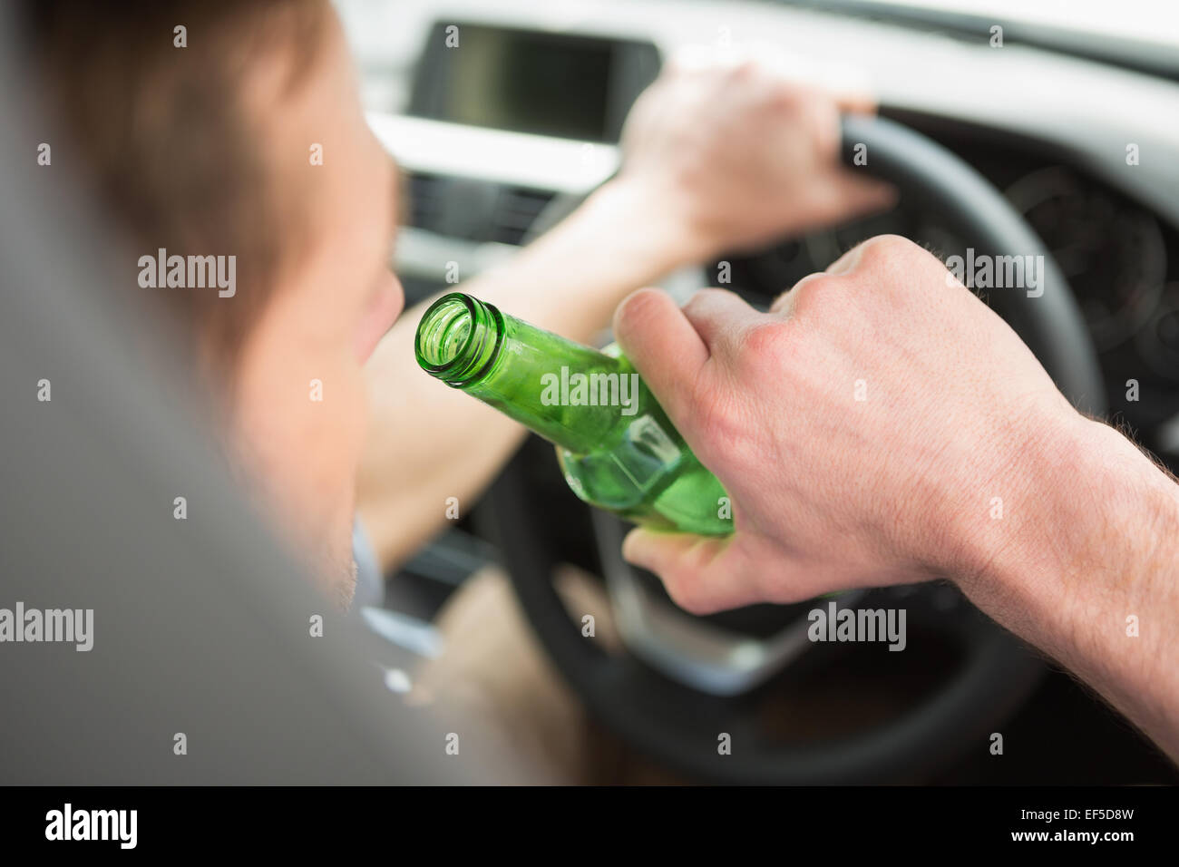 Man drinking beer while driving Stock Photo - Alamy
