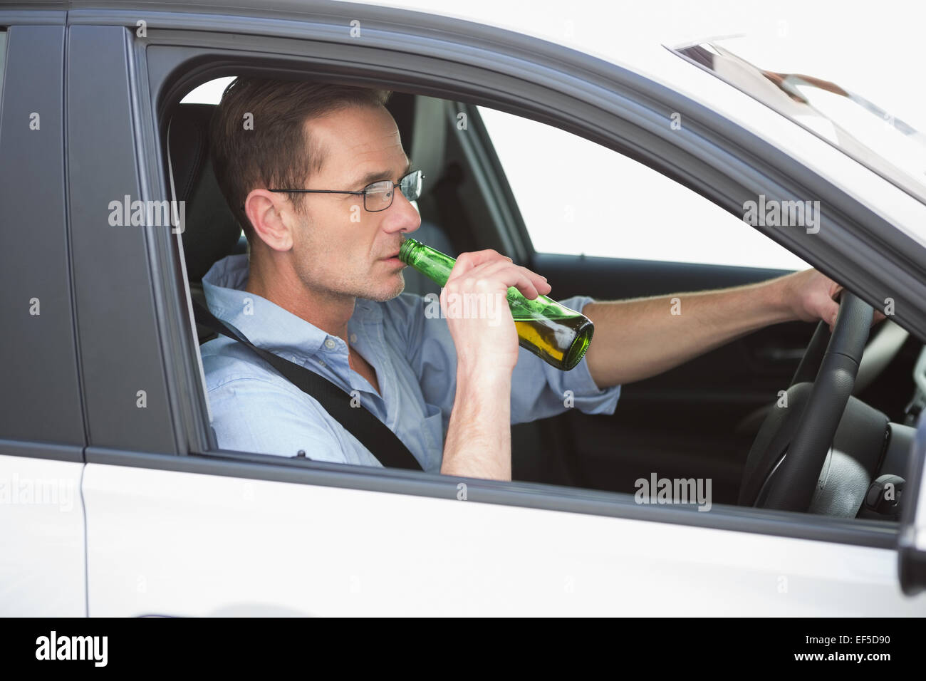 Man drinking beer while driving Stock Photo - Alamy