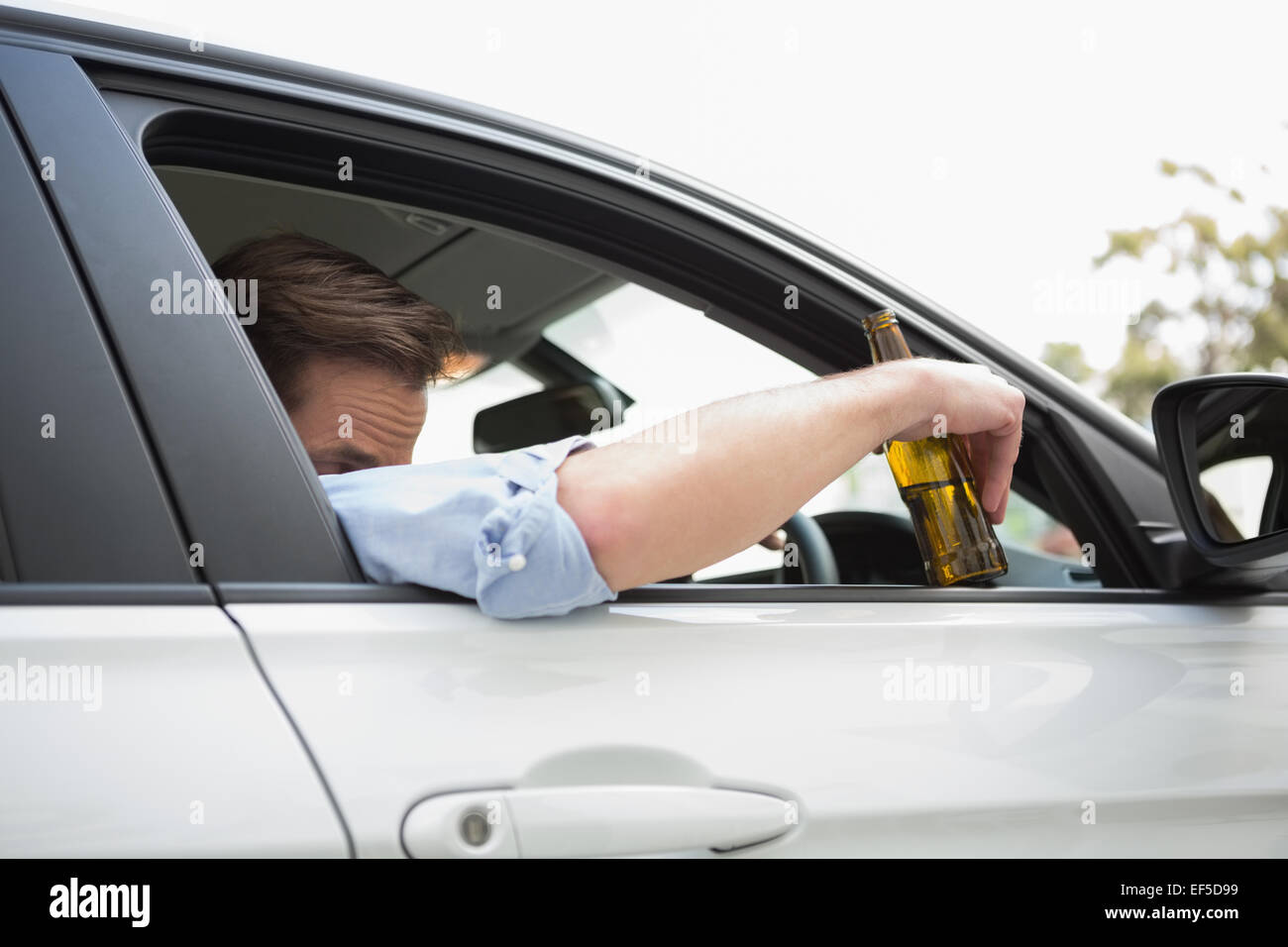 Man drinking beer while driving Stock Photo - Alamy